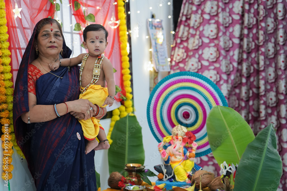 Foto de Grandmother and Baby Krishna Ritual, Traditional Hindu Festival ...