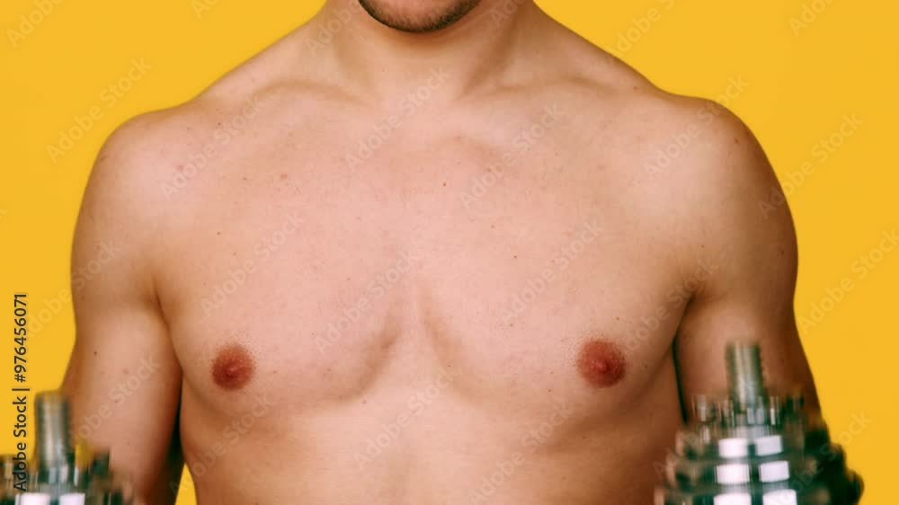 A young man showcases his fit physique, standing confidently with a ...