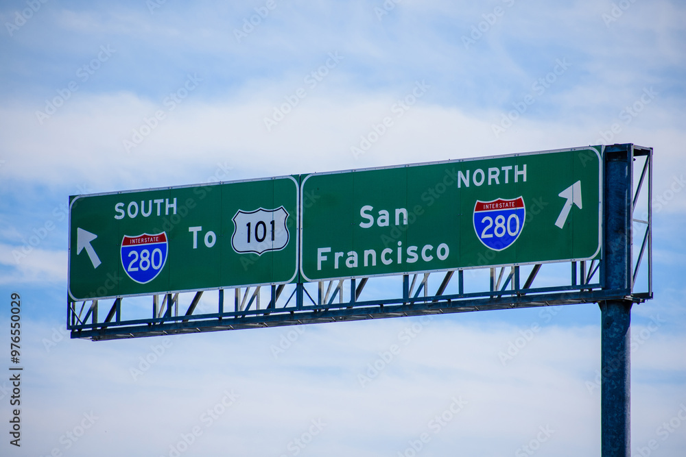 Overhead freeway sign indicating routes for interstate highway 280 ...