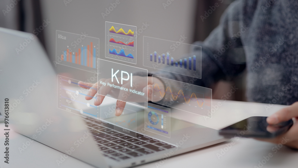 Women use laptops to analyze key performance indicators (KPI) with ...
