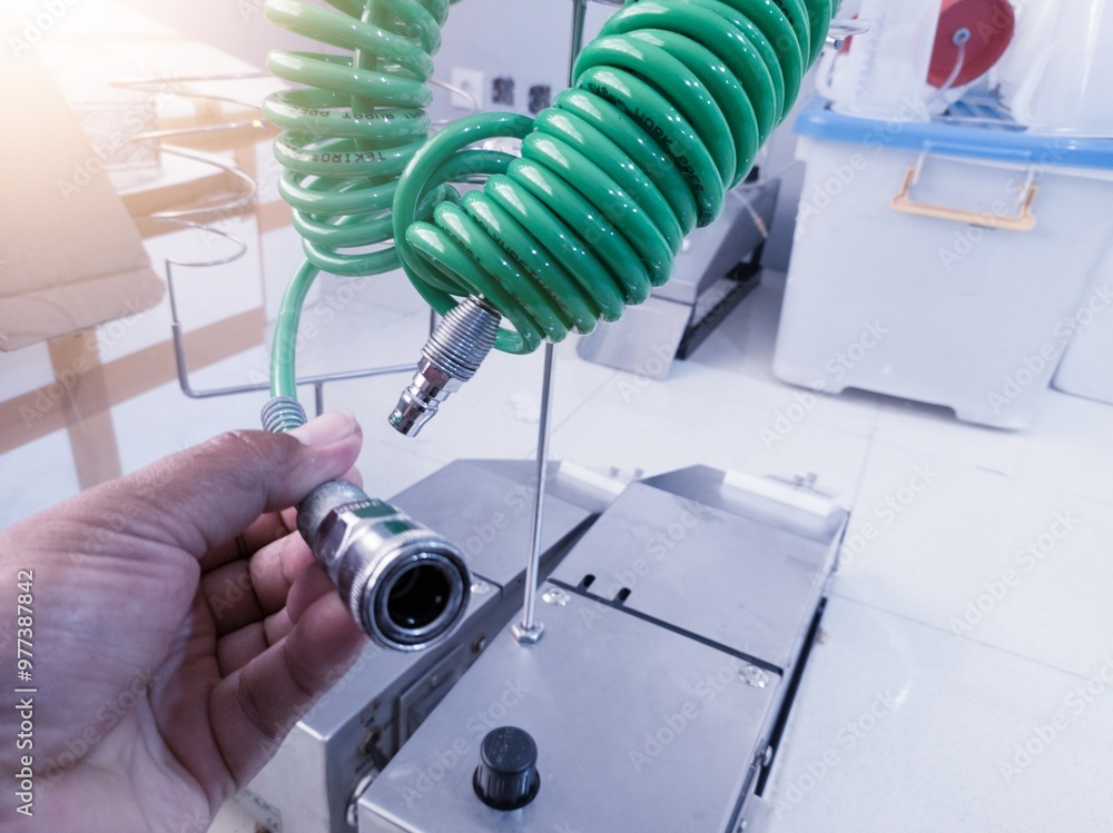 Hand hold the coupler hose air supply pneumatic system compressor on ...