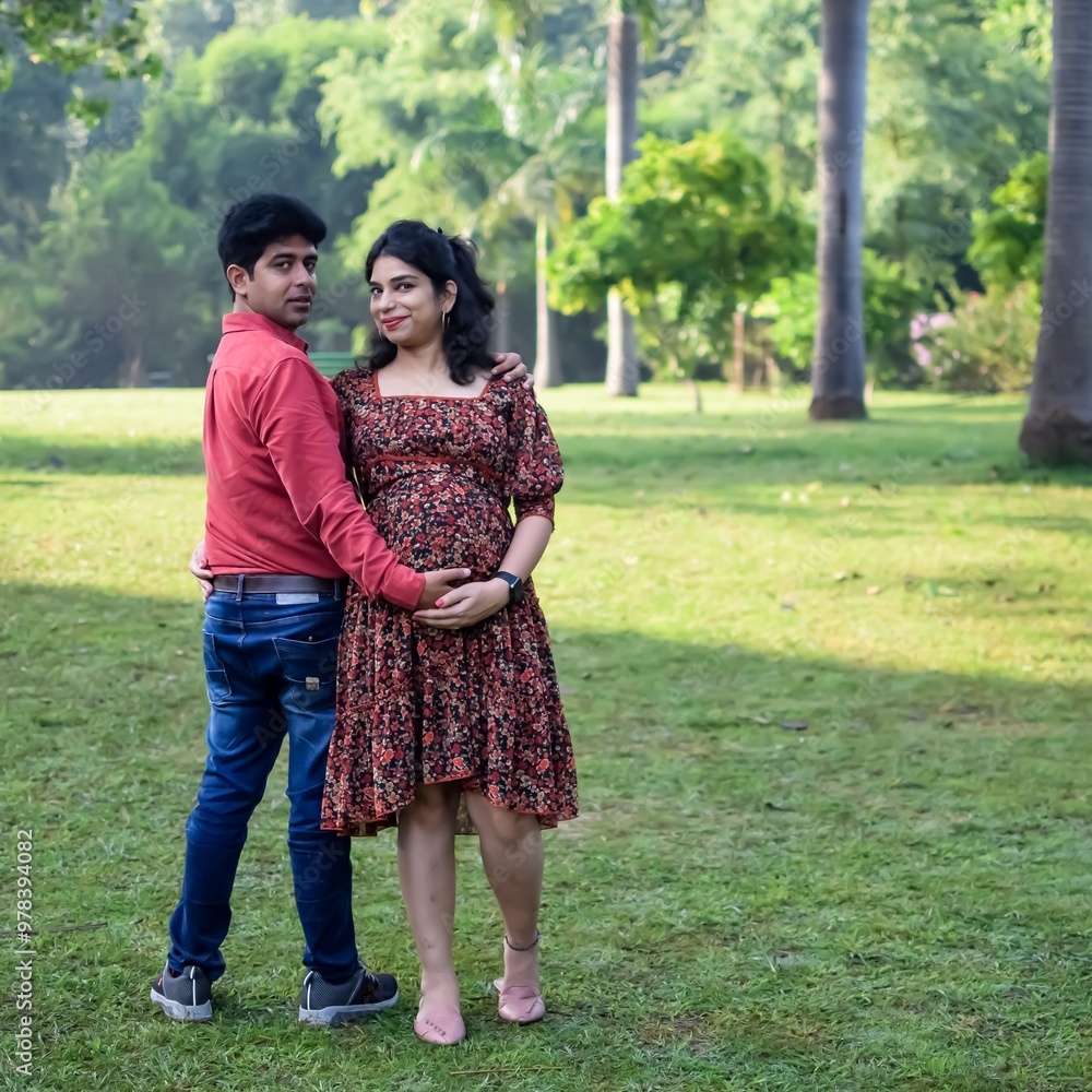 Indian couple posing for Maternity shoot pose for welcoming new born ...