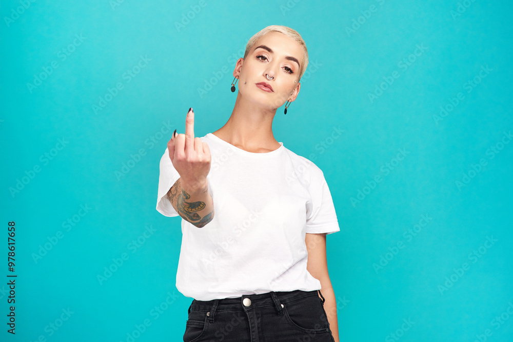 Middle finger, serious and portrait of woman in studio for opinion ...