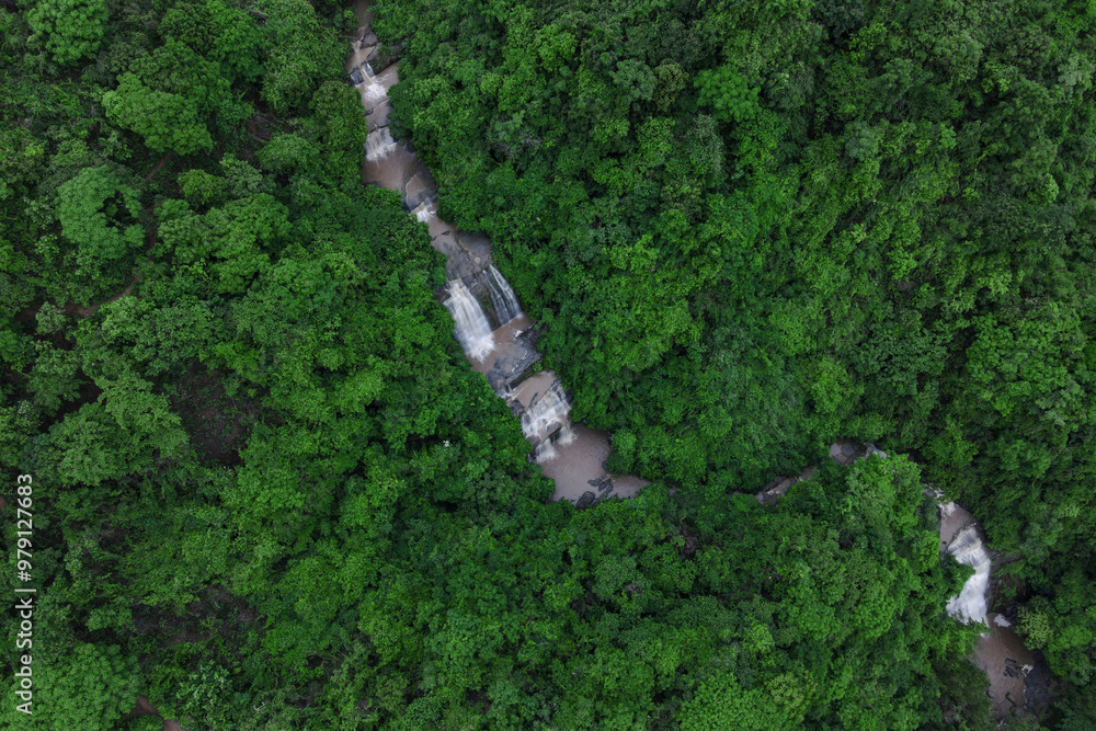 Aerial view of khaiyachara waterfalls cascading through lush green ...