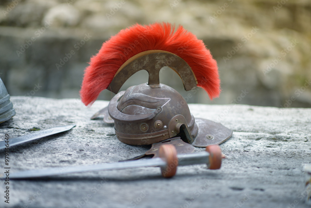 Roman-Style Helmet with Red Plume and Sword Evoking Ancient Military ...