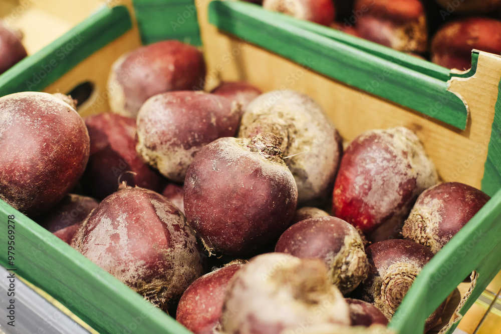 Beets in a cardboard box at the grocery store background. Raw, eco ...