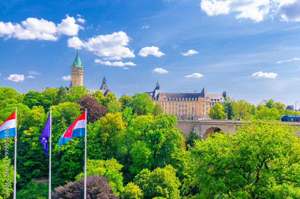 Luxembourg City historical centre with Luxembourg and EU flags on poles ...