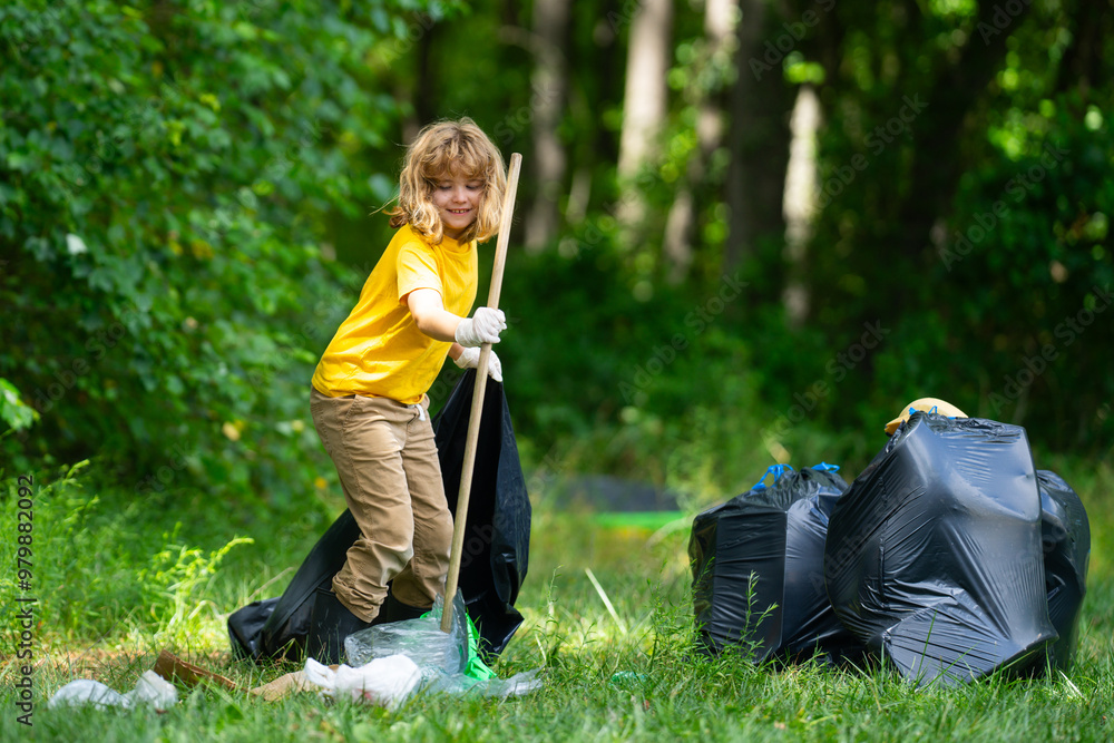 Kid cleaning up the park, putting trash in a garbage bag. Environmental ...
