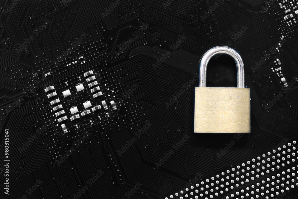 Golden master key in lock placed on a computer motherboard background ...