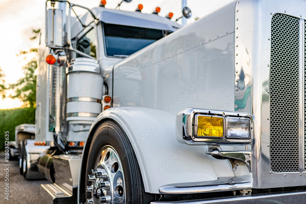 Classic powerful big rig white semi truck tractor with chrome parts and ...