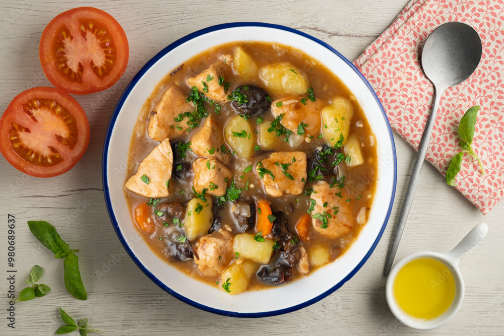 Turkey stew with prunes and potatoes. Top view table with decoration ...