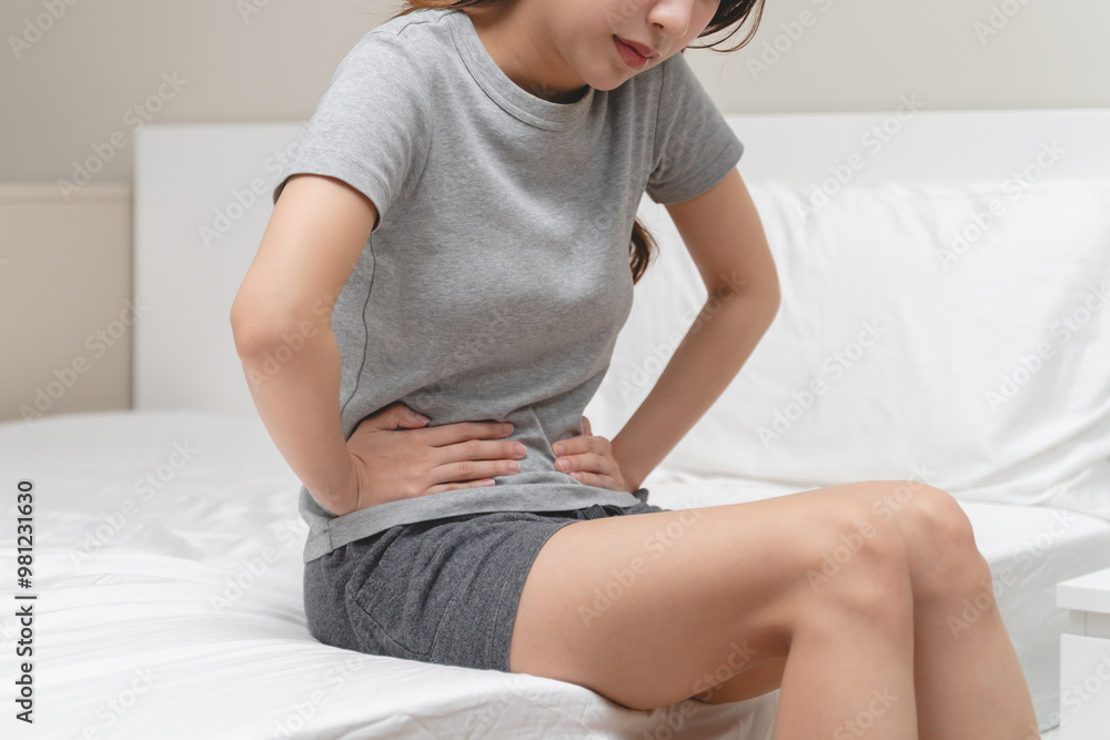 Menstruation symptom concept, Close-up woman touching her belly and ...