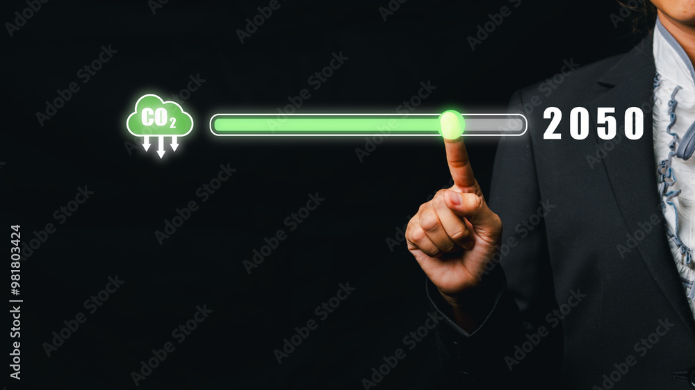 Businessperson pointing at a carbon neutrality progress bar with a CO2 ...