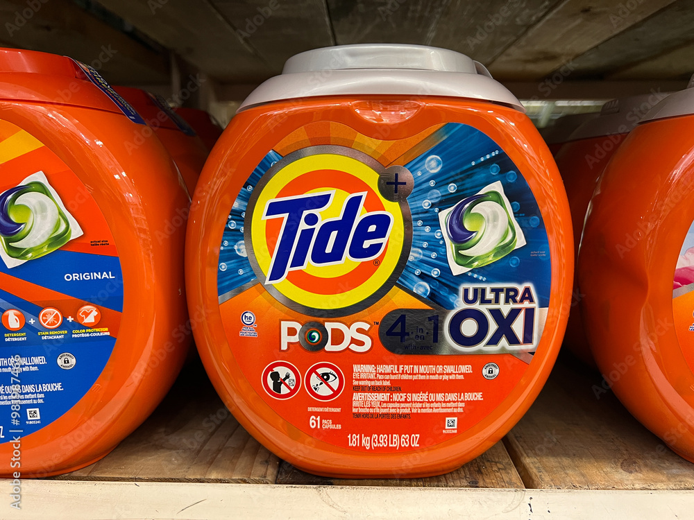 Container of Tide Pods laundry detergent with Ultra Oxi on a shelf ...
