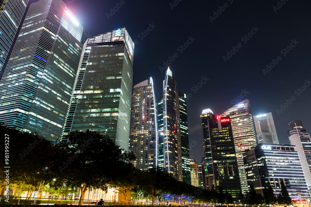 Singapore- July 19, 2024: Night view of the Marina Bay Financial Centre ...