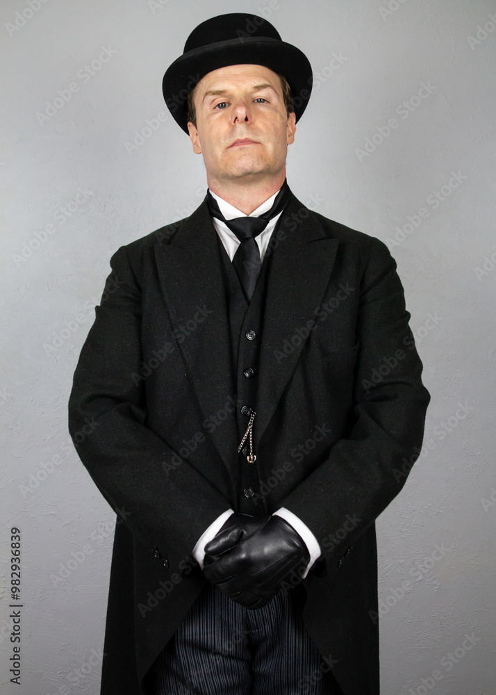 British Butler in Dark Formal Suit and Bowler Hat Standing at Polite ...