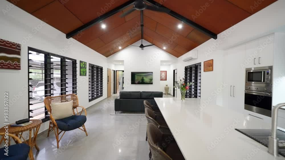 Spacious open-plan tropical villa interior with high ceilings, natural ...
