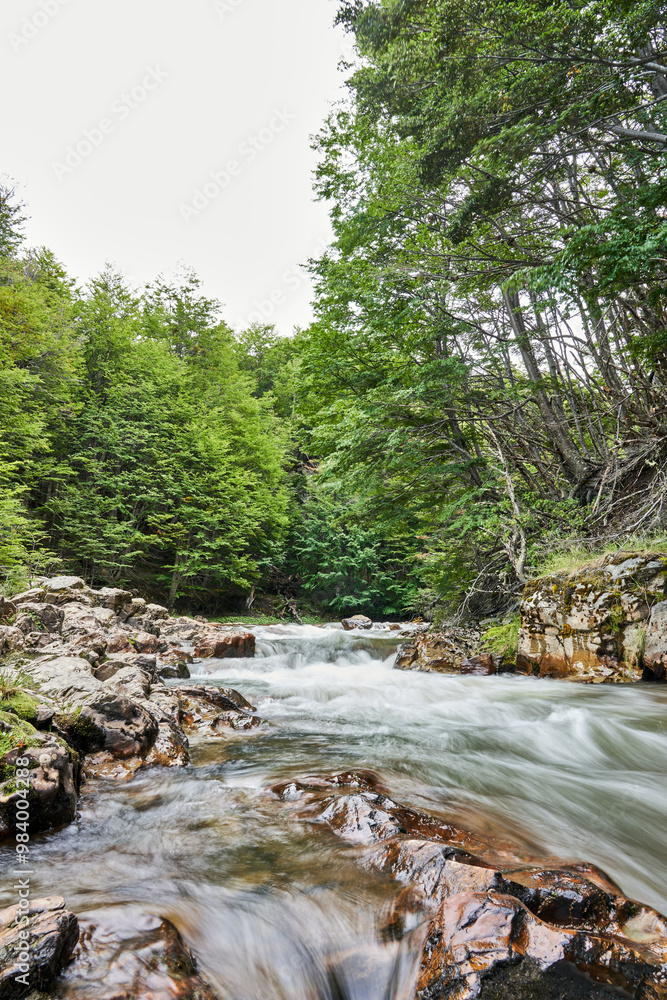 Cascada Río Pipo flows through a rocky landscape surrounded by lush ...