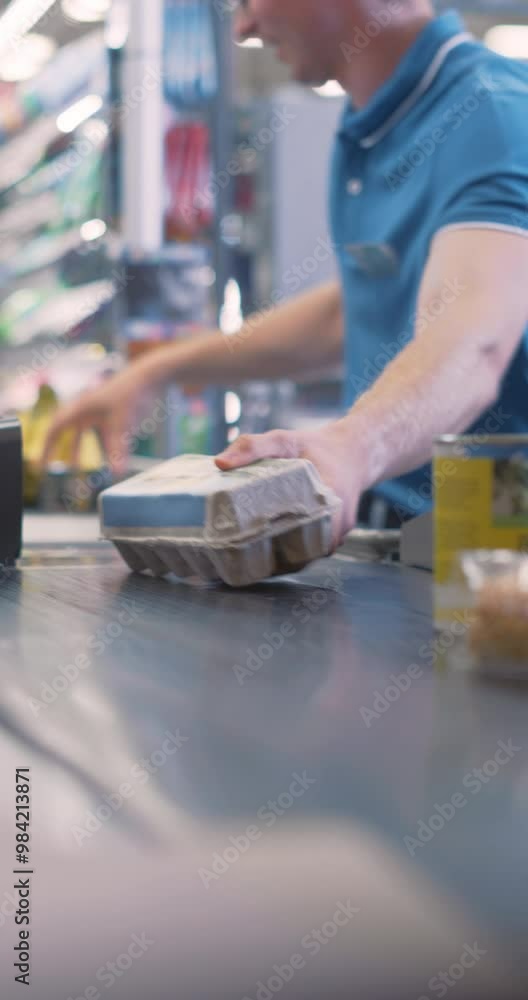 Vertical Footage: Portrait of a Male Cashier in a Blue Shirt ...
