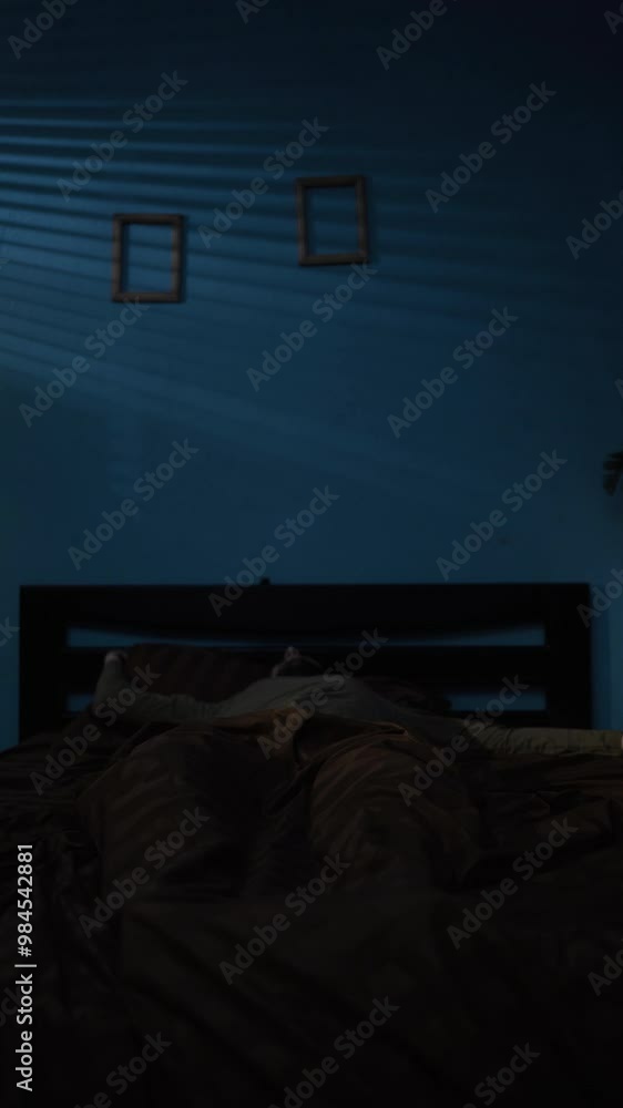 Insomnia and nightmare concept. Shocked scared man waking up from a ...