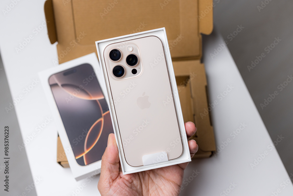 Unbox apple iphone 16 pro Desert Titanium Stock Photo | Adobe Stock