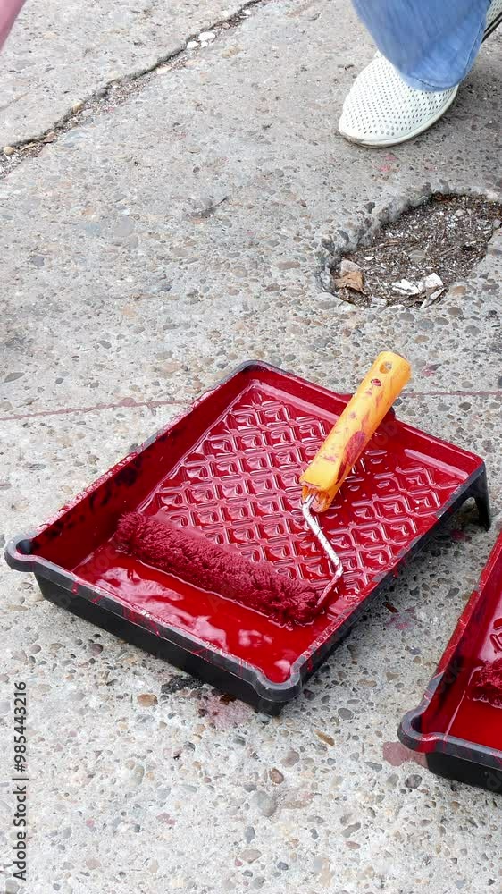 Watch as a vibrant red paint brings new life to a concrete surface ...