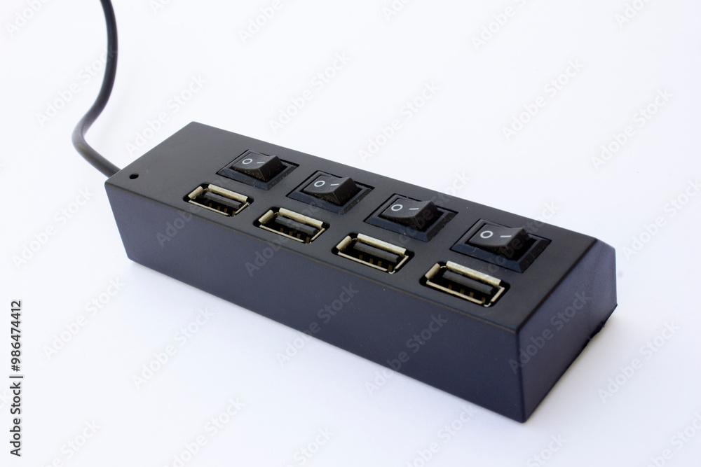 A black multiport USB hub is a device that allows you to connect ...