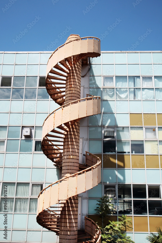 Emergency exit stairs of a multi-storey building.Front view of spiral ...