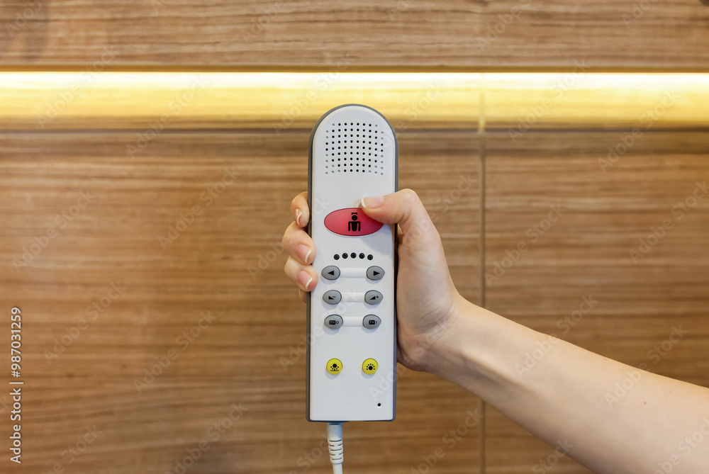 Nurse call button in patient room in modern hospital. Hand pushing ...