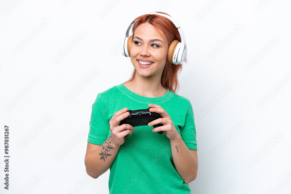 Young Russian girl playing with a video game controller isolated on ...