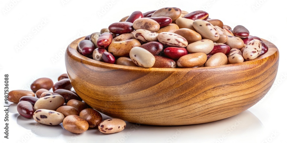 Foul-smelling beans assume a gloomy presence in a wooden bowl, their ...