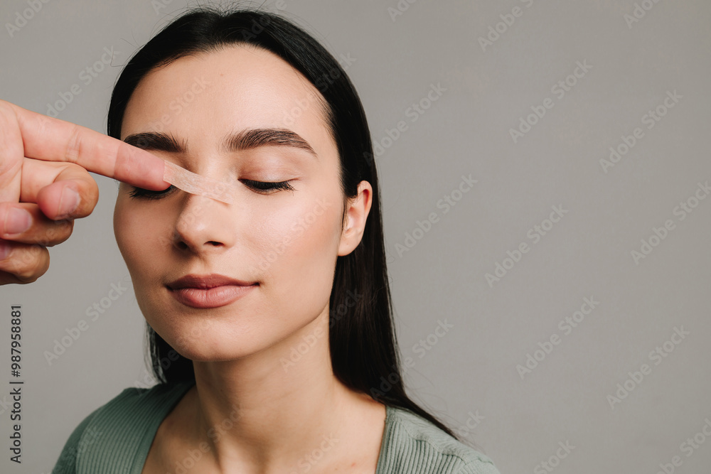 Rhinoplasty. Applying bandage on nose after surgery to support its ...