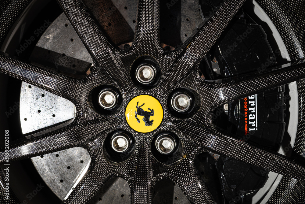 Ferrari. The logo sign of a powerful Ferrari super car. Close up photo ...