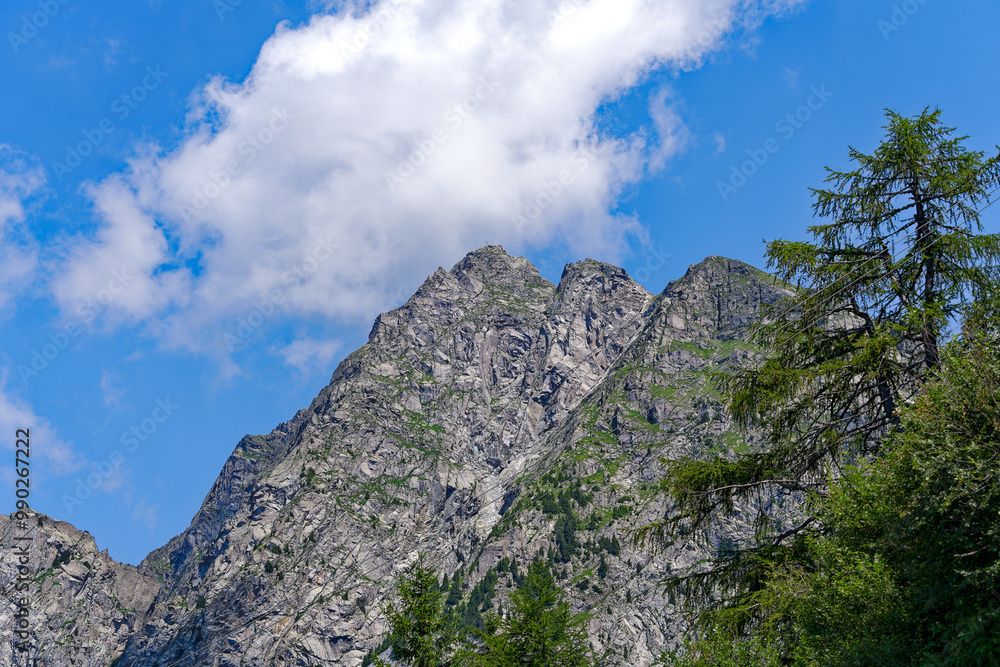 Looking up mountain peaks with rocks and cliffs at mountain resort of ...