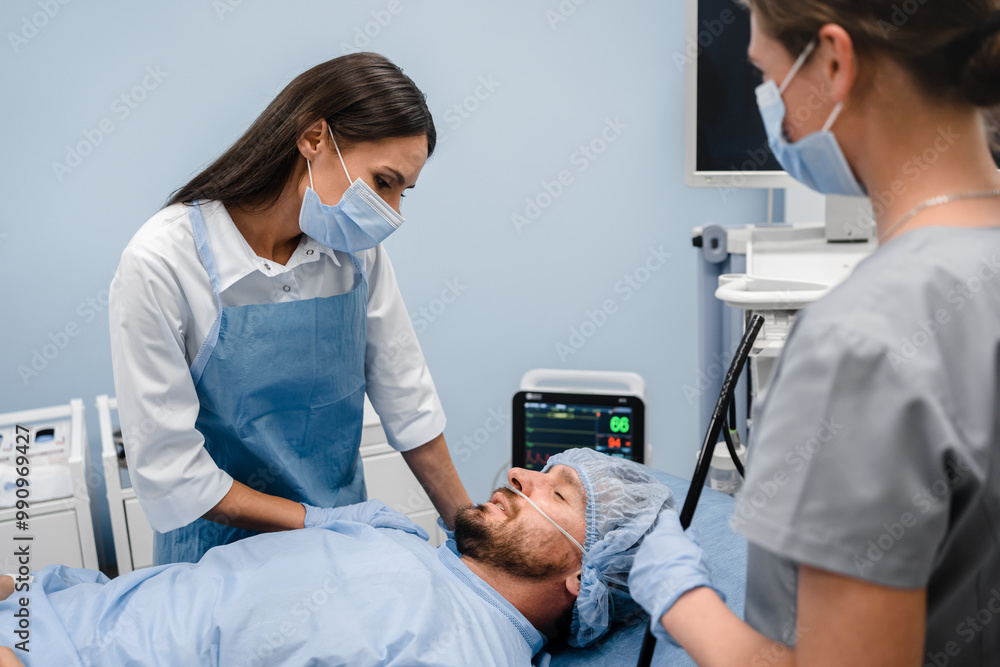 Female doctor checking to patient before endoscopy colonoscopy ...