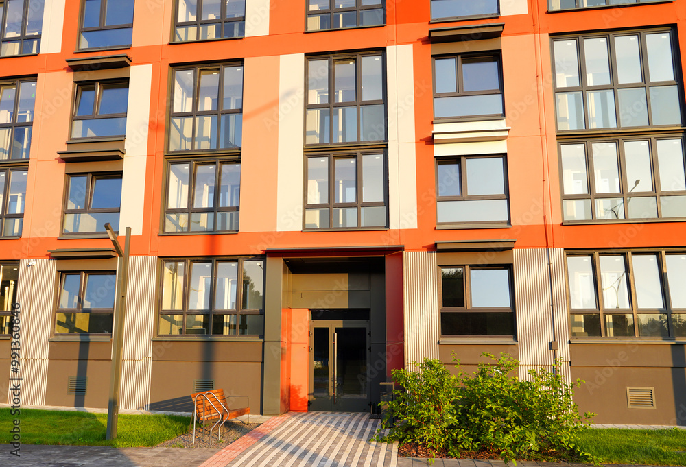 Entrance to Condo house complex. Eco-friendly residential building with ...