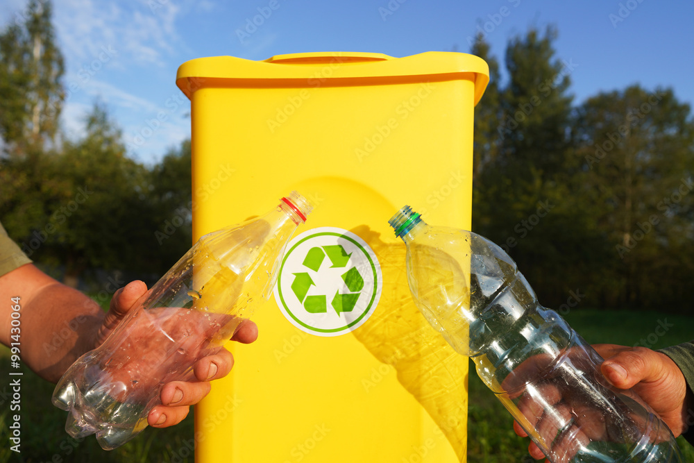 Plastic sorting for Recycling. Empty plastic bottles in trash bin ...