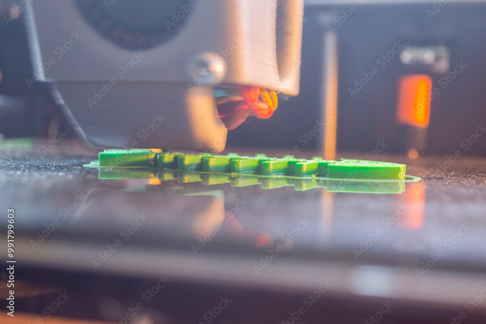 3D printer close up. A working 3D printer in process of printing object ...