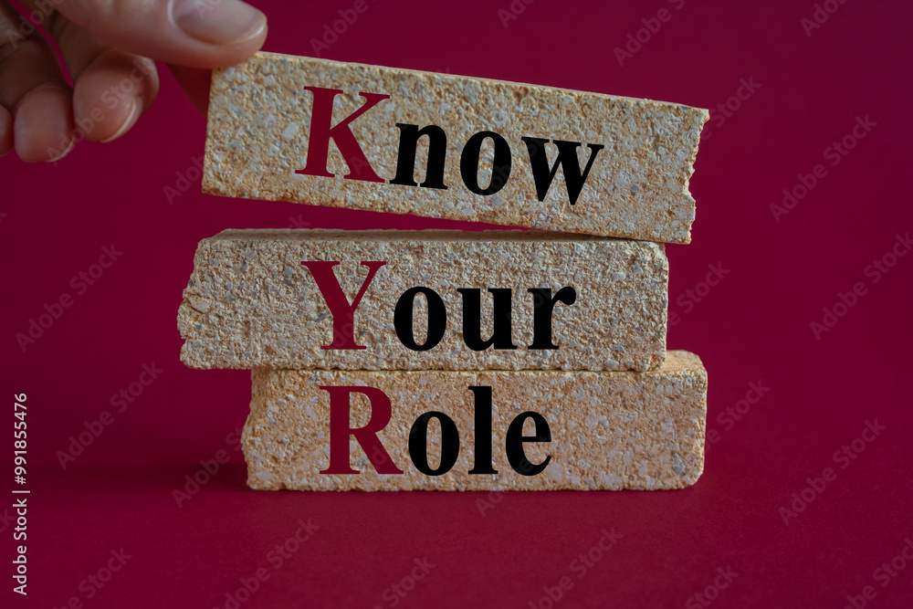 Know Your Role symbol. Know Your Role message written on brick blocks ...