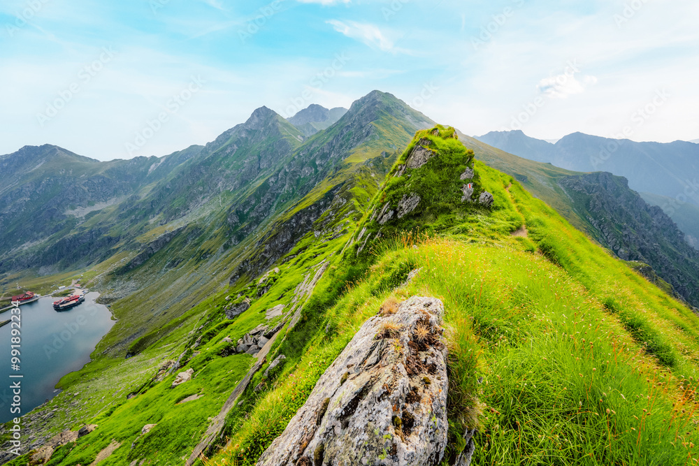 Hiking in Fagaras mountains on Iezerul Caprei peak over Transfagarasan ...
