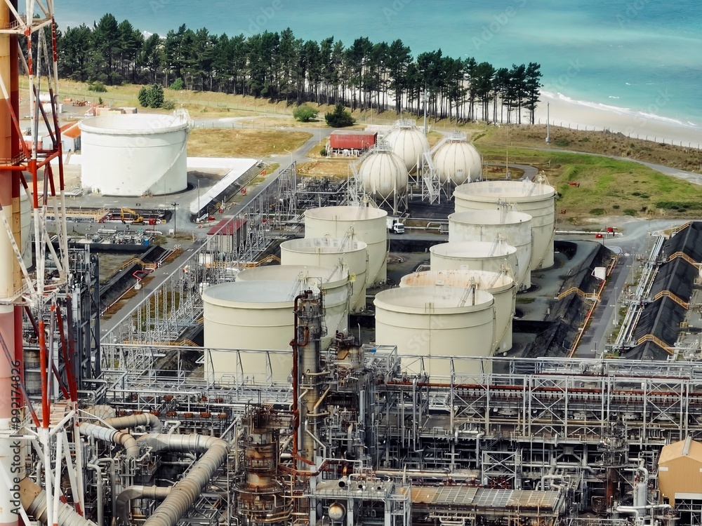 Chimney stacks and storage tanks at the decommisioned Marsden Point ...