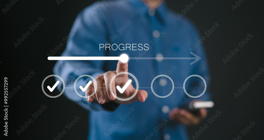 Businessman touches a digital progress checklist with check marks and ...