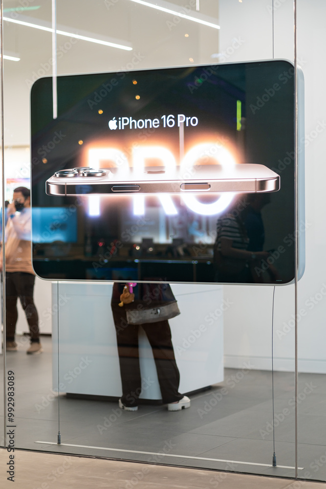 iPhone 16 Pro series billboard in a store. A large light box promoting ...
