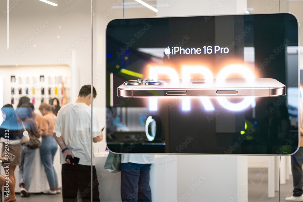 iPhone 16 Pro series billboard in a store. A large light box promoting ...