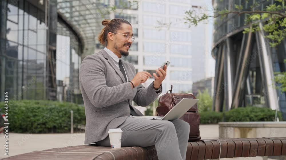 Positive Caucasian man ending phone call. Finishing conversation ...