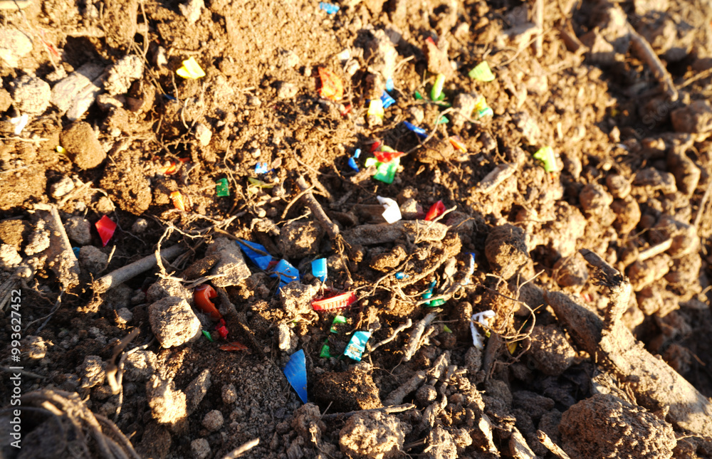 Microplastic pollution. Microplastics in ground. Soil contaminated with ...
