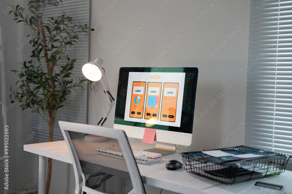 Modern home office with a computer displaying ux/ui design work for a ...