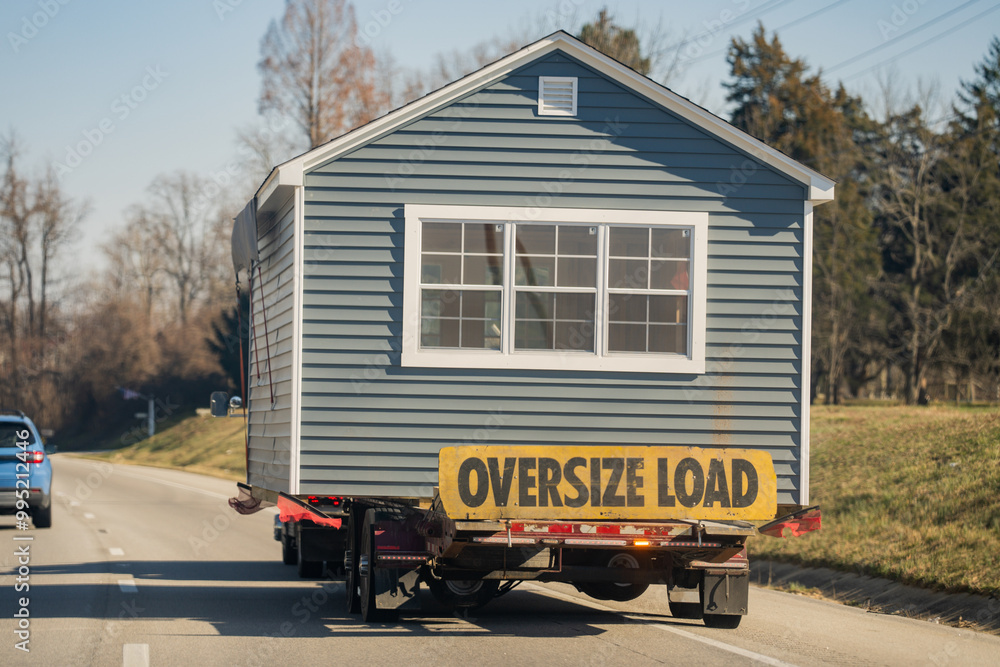 Oversize load. Manufactured house transported on the highway. Mobile ...