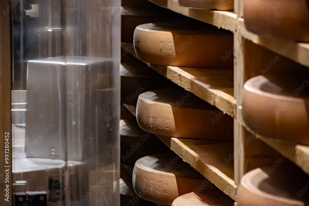 Aging rooms with shelves in cheese caves, central location for aging of ...