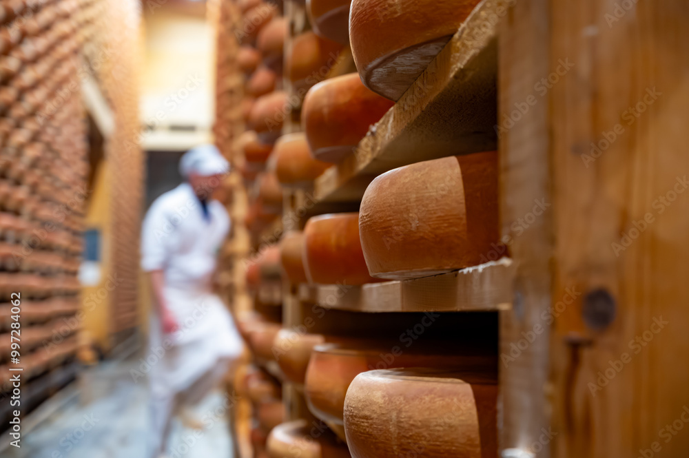 Aging rooms with shelves in cheese caves, central location for aging of ...